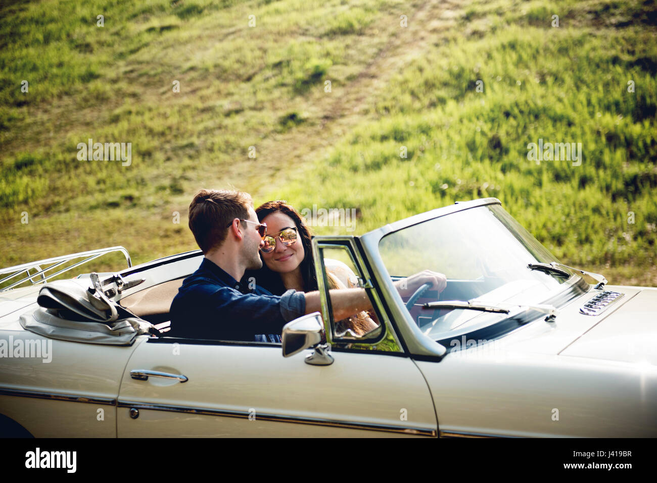 Couple Driving a Car Traveling on Road Trip Together Stock Photo - Alamy