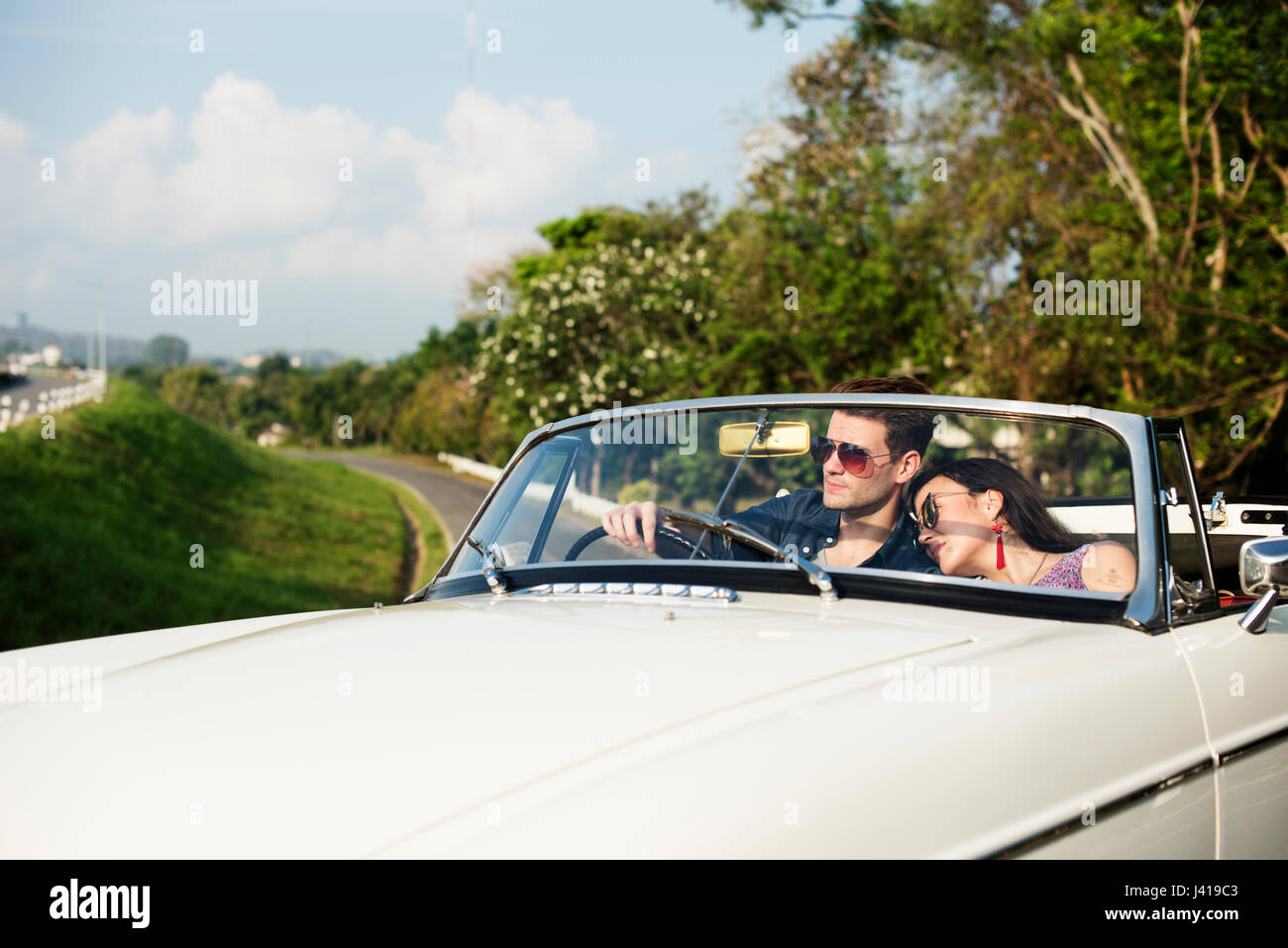Couple Driving a Car Traveling on Road Trip Together Stock Photo - Alamy