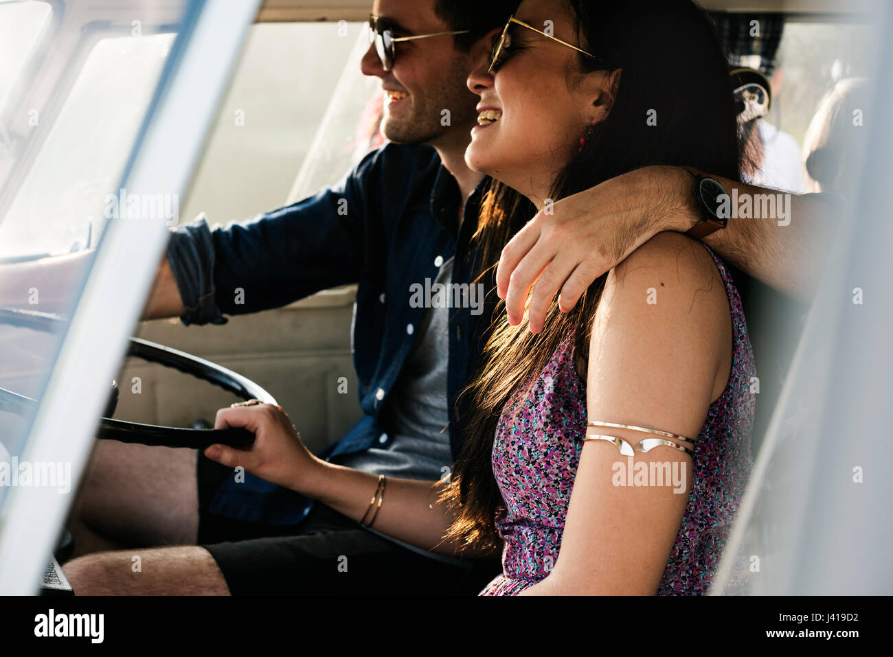 Couple Driving a Car Traveling on Road Trip Together Stock Photo - Alamy