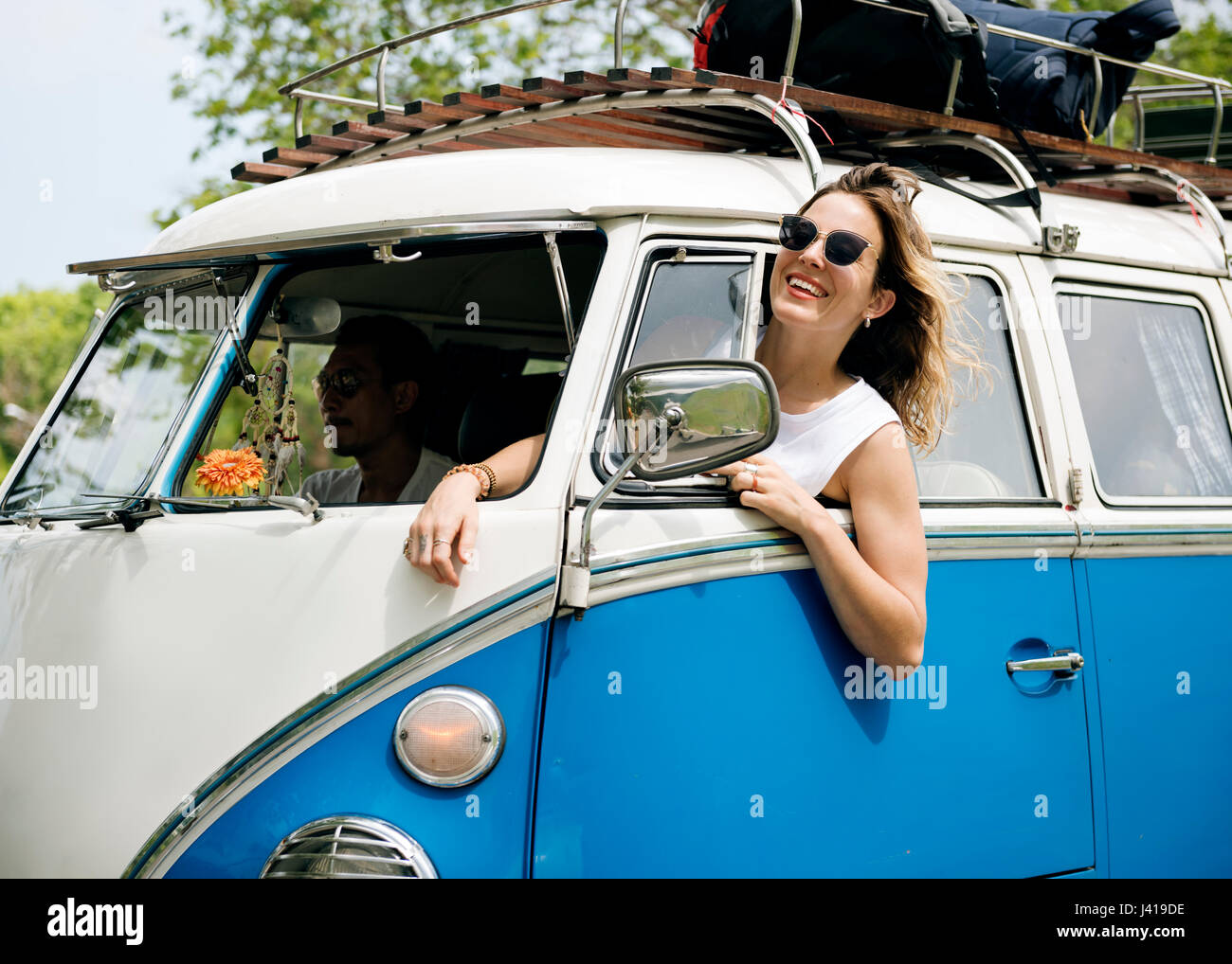 Woman Sitting in a Car Put Head Out of Window Wind Blowing Her Hair ...