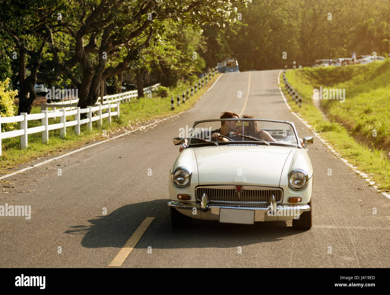 Couple Driving a Car Traveling on Road Trip Together Stock Photo - Alamy