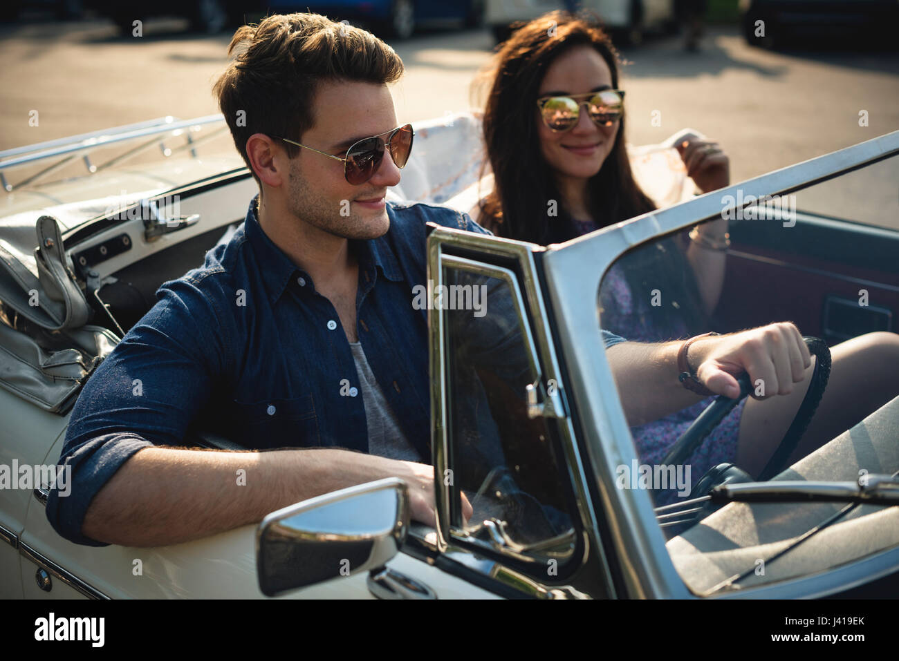Couple Driving a Car Traveling on Road Trip Together Stock Photo - Alamy