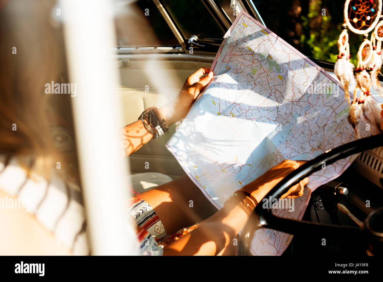 People Checking The Map for Direction on Road Trip Stock Photo - Alamy