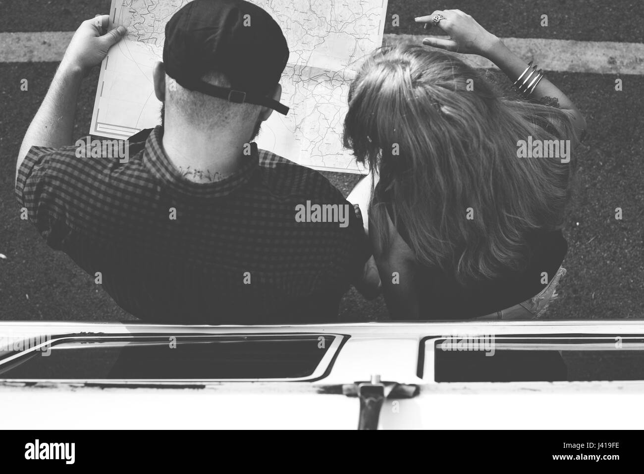 People Checking The Map for Direction on Road Trip Stock Photo - Alamy