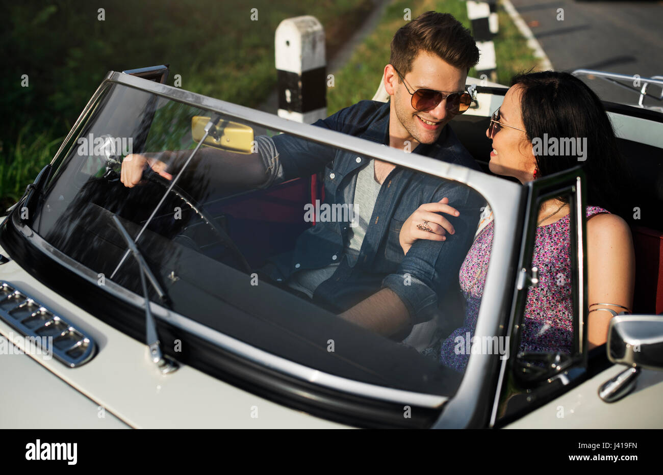 Couple Driving a Car Traveling on Road Trip Together Stock Photo - Alamy