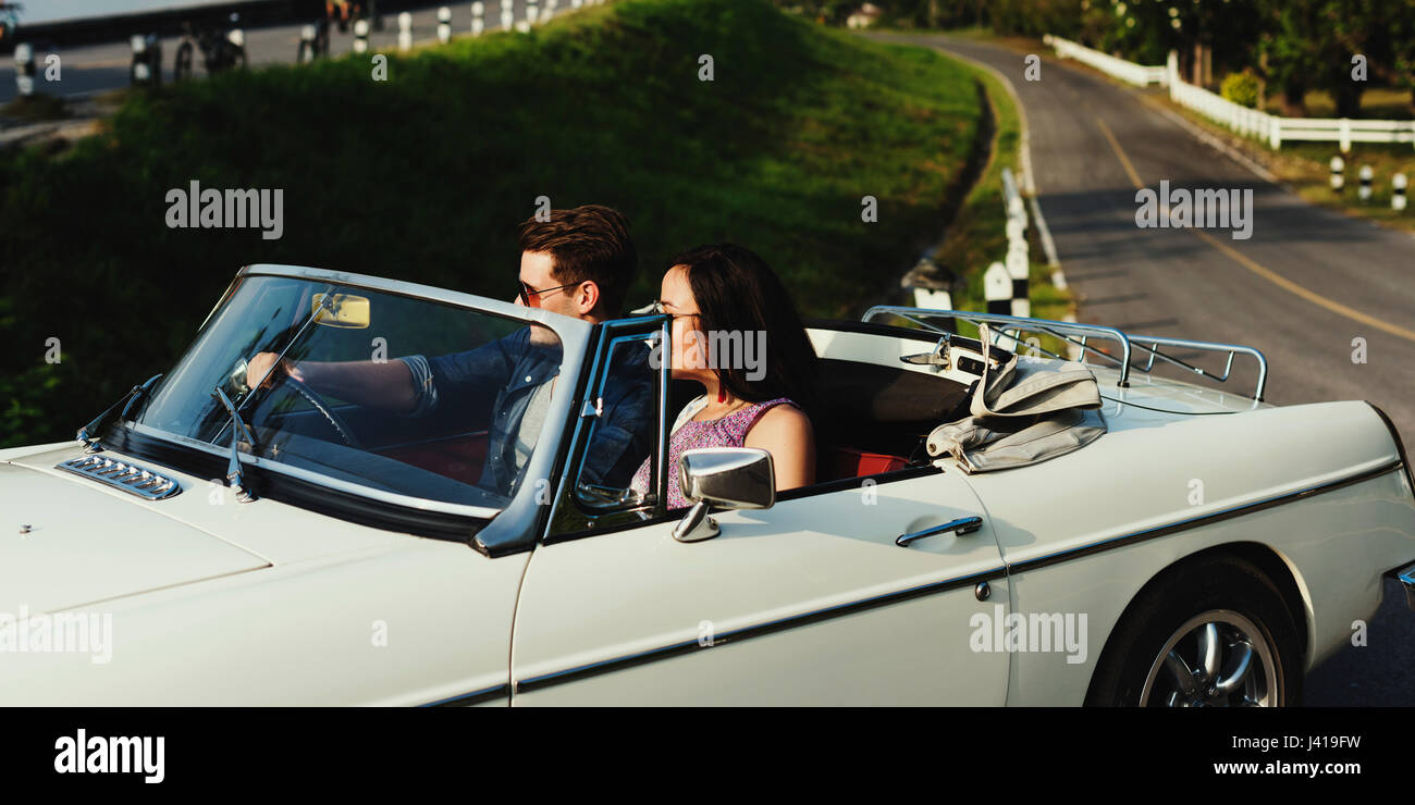 Couple Driving a Car Traveling on Road Trip Together Stock Photo - Alamy