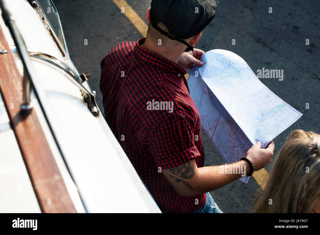 People Checking The Map for Direction on Road Trip Stock Photo - Alamy