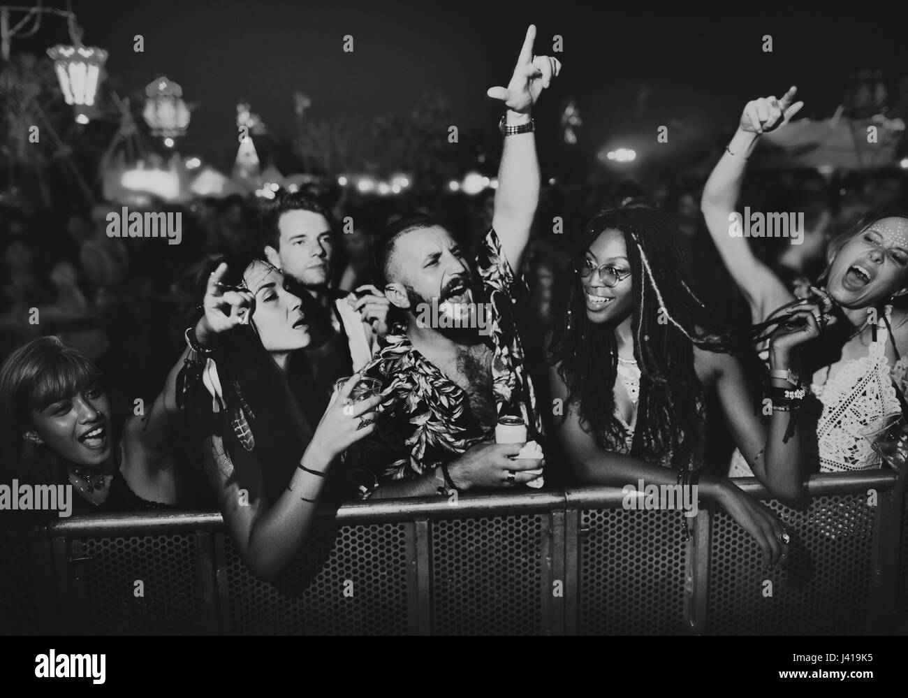 Group of people enjoying live music Black and White Stock Photos ...
