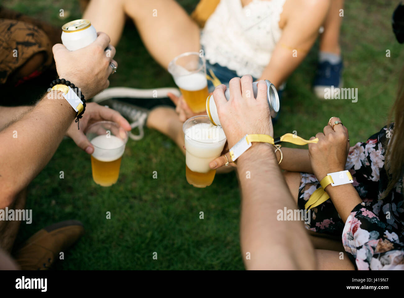 Group of Friends Drinking Beers Enjoying Music Festival Together Stock ...