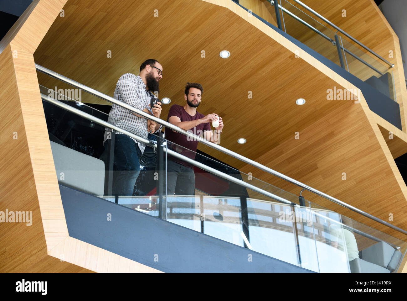 People Talking Together During Office Break Time Stock Photo - Alamy