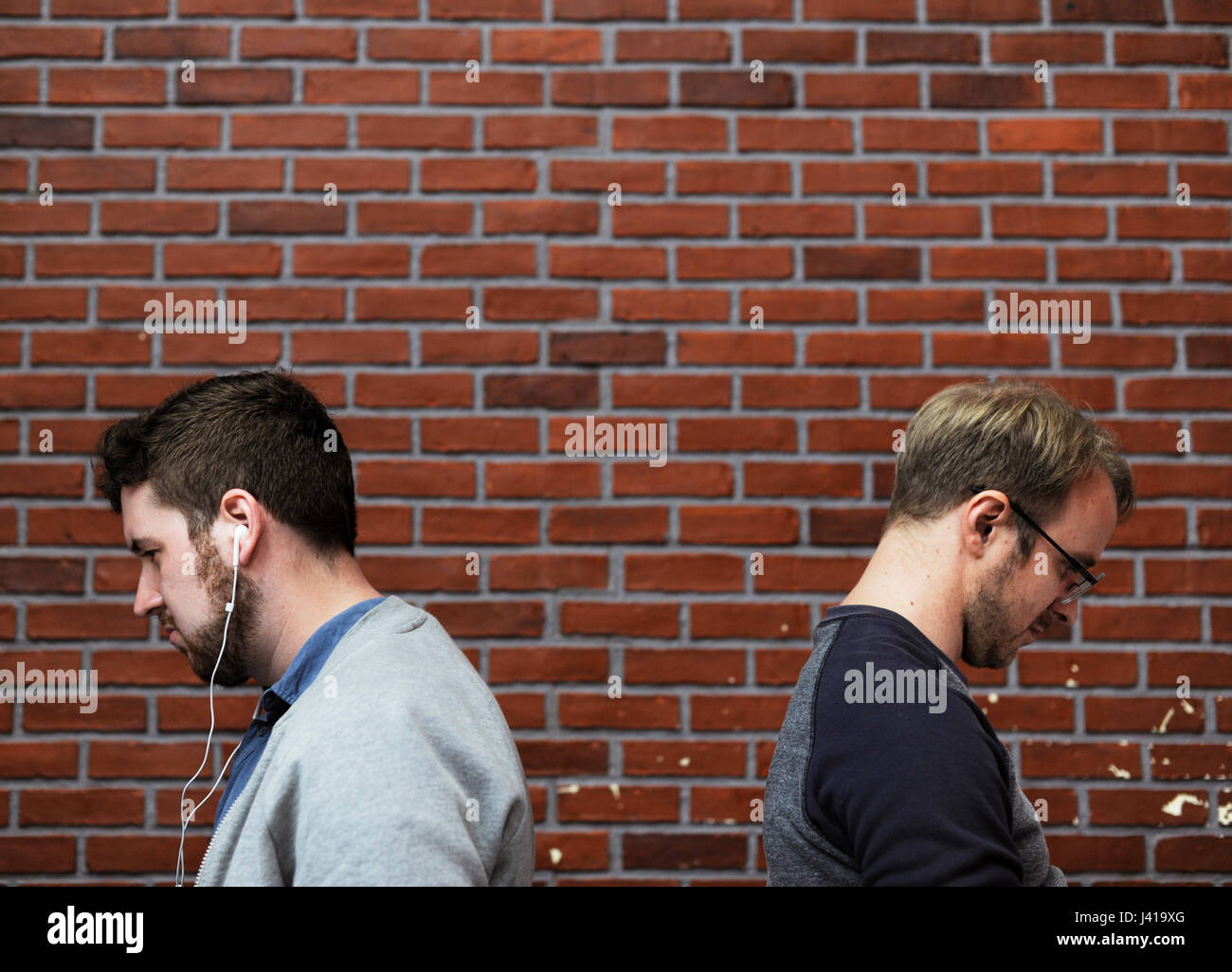 Men Relaxing on Break Time with Brick Walls Background Stock Photo - Alamy