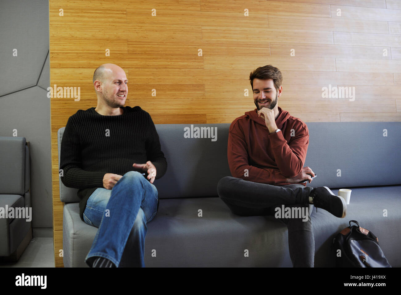 People Talking Together During Office Break Time Stock Photo - Alamy