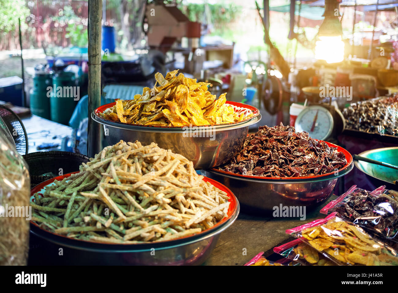 Thai food close up frying chips from fruits and vegetables in ...