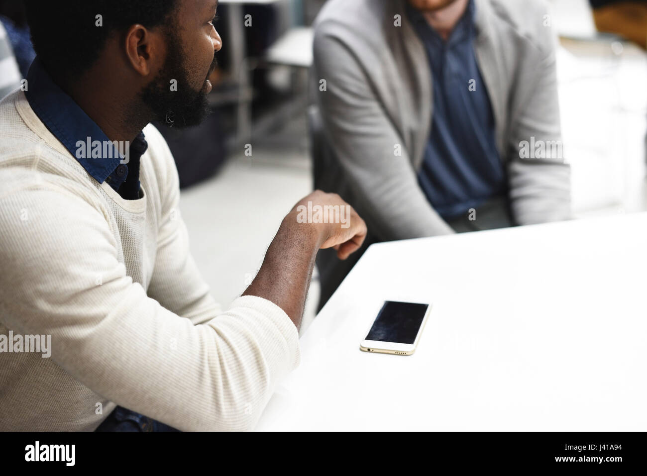 People Talking Together During Office Break Time Stock Photo - Alamy