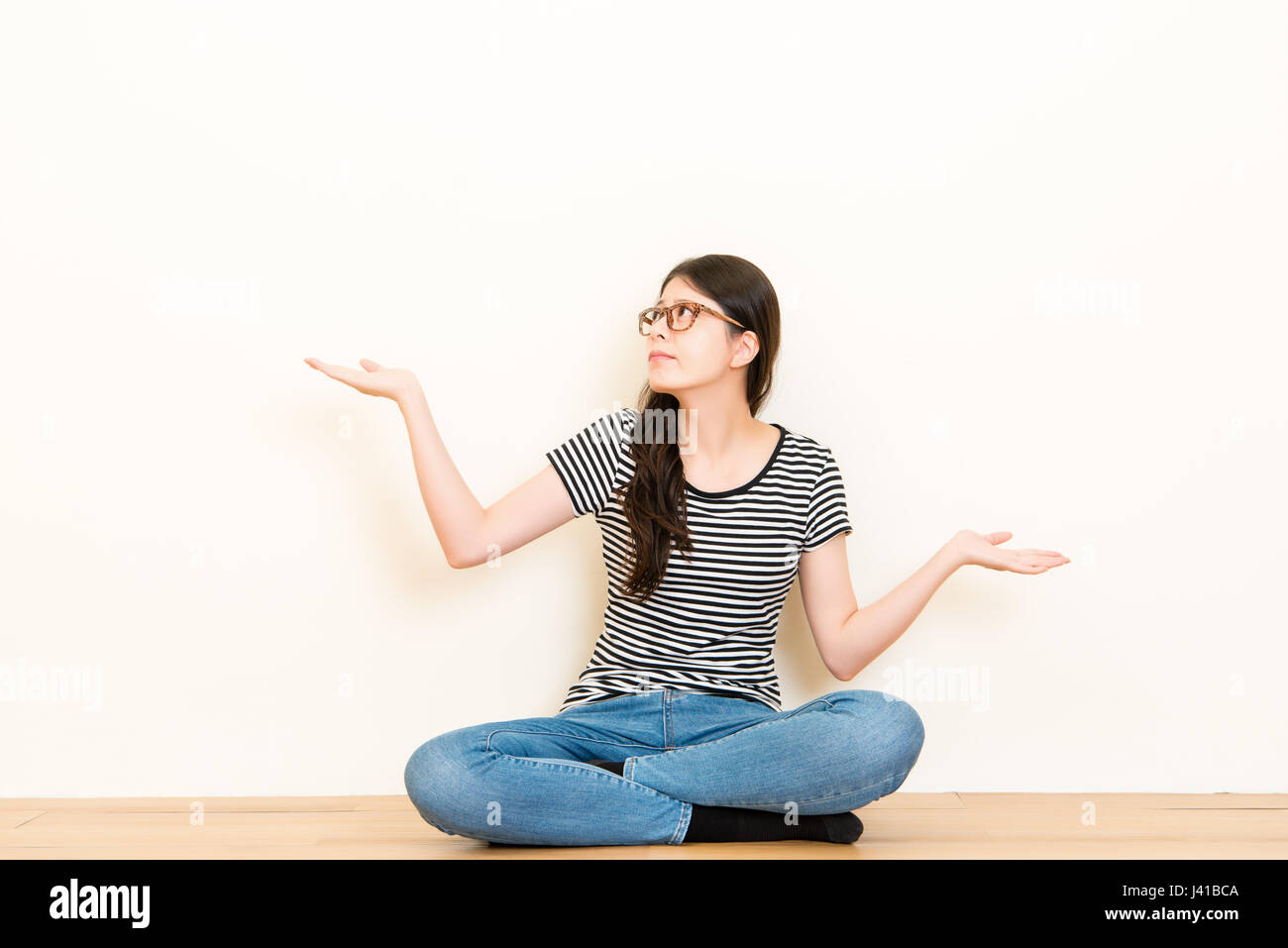 Portrait dumb looking woman arms out shrugs shoulders isolated on white ...