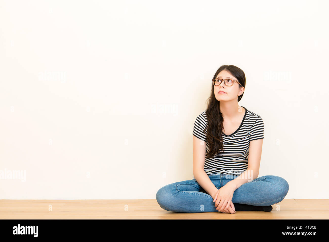 Thoughtful young girl thinks worry about her future and dreaming ...