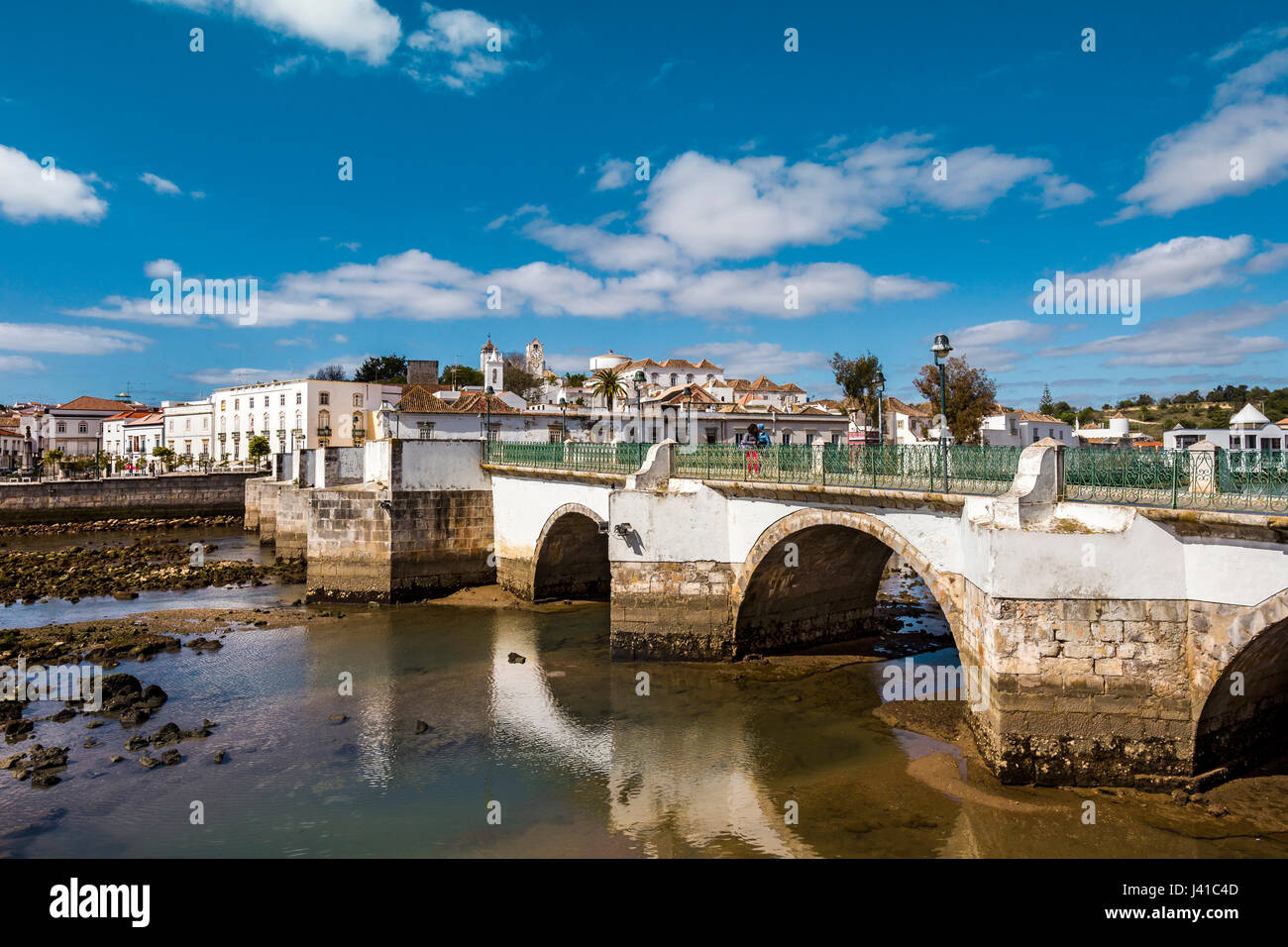View across Rio Gilao towards the old town and roman bridge, Tavira ...