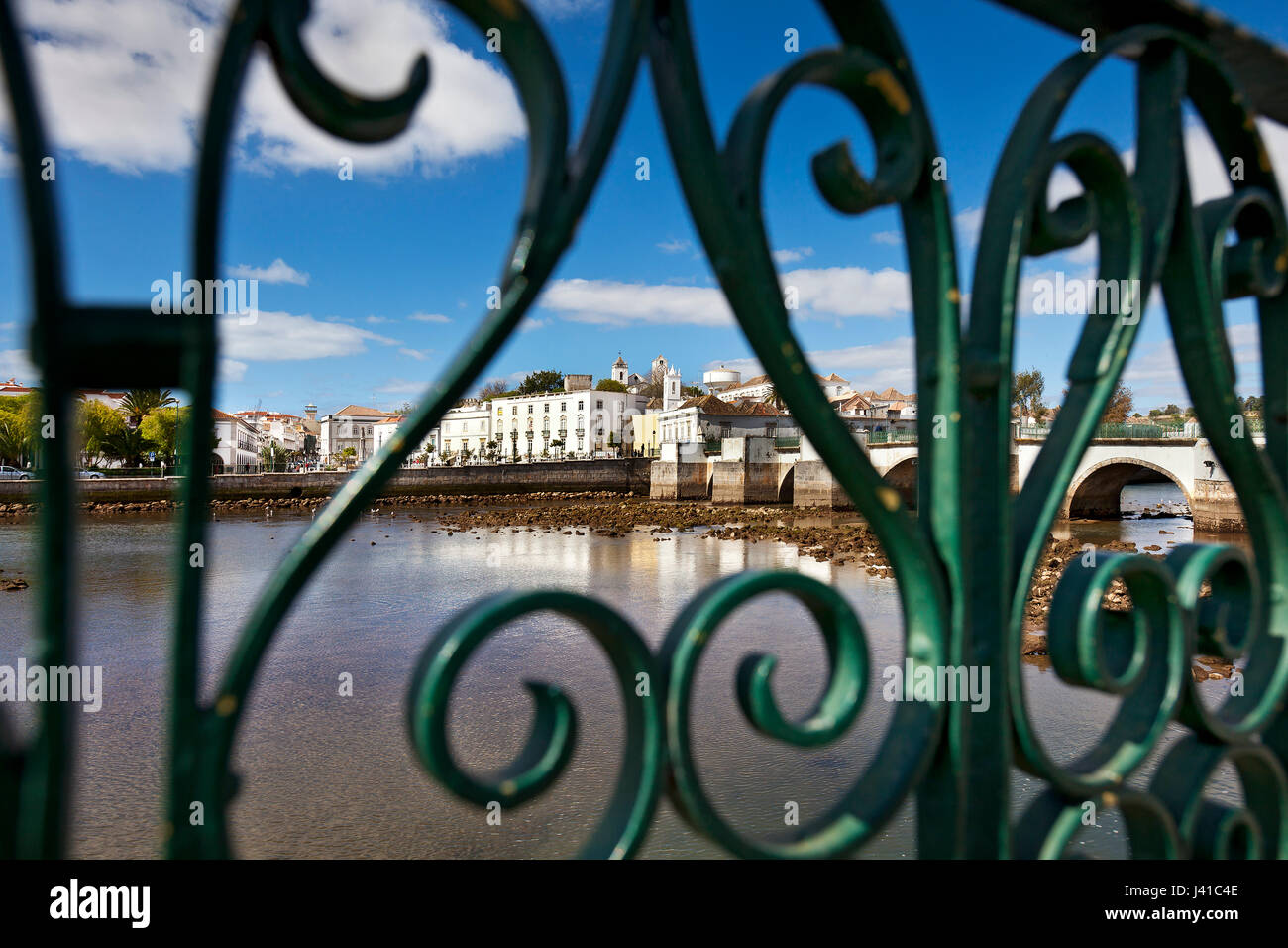 View across Rio Gilao towards old town and roman bridge, Tavira ...