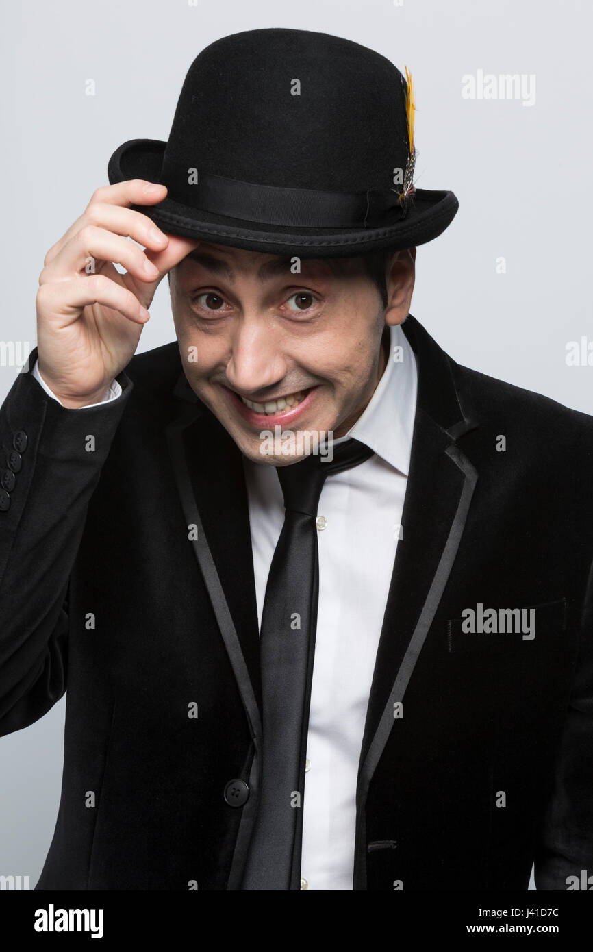 Portrait of man wearing a black bowler hat and a black suit Stock Photo ...