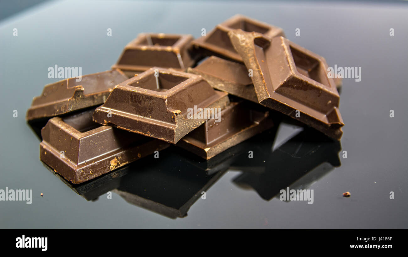 Pieces of chocolate bar on neutral background Stock Photo - Alamy
