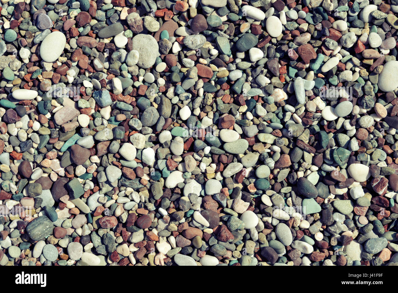 Colorful sea stones on beach, top view Stock Photo - Alamy