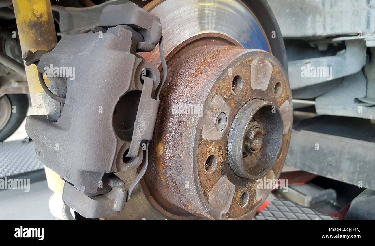 Back rusty disk brake with caliper Stock Photo - Alamy