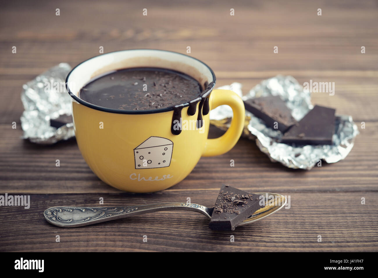 Hot chocolate in mug with chocolate bar on wooden background closeup ...