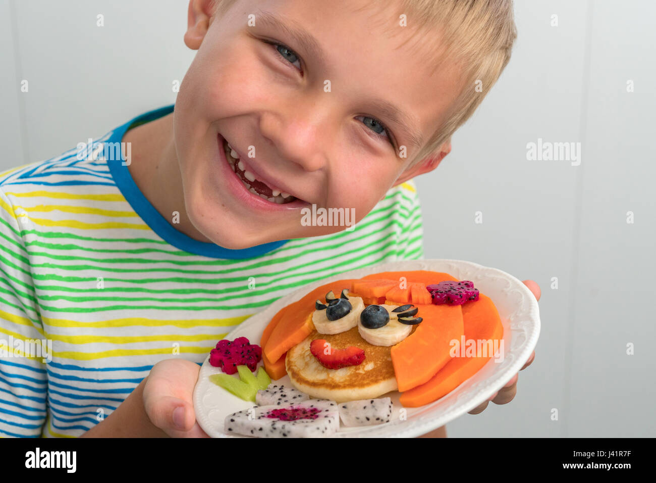 Funny girl pancake face with fruits and berries Stock Photo - Alamy