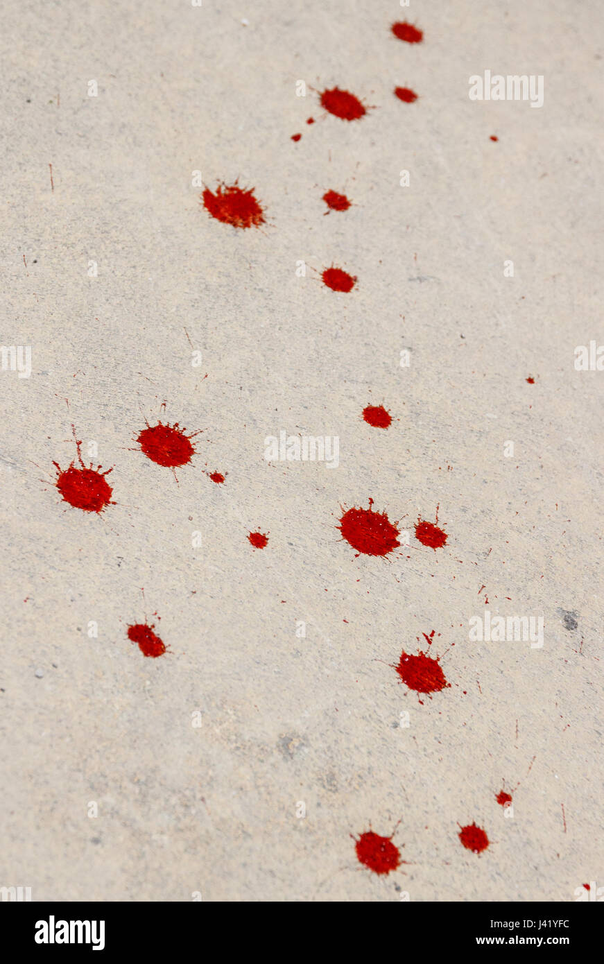 Splatters of fresh human bright red blood on a concrete surface Stock ...