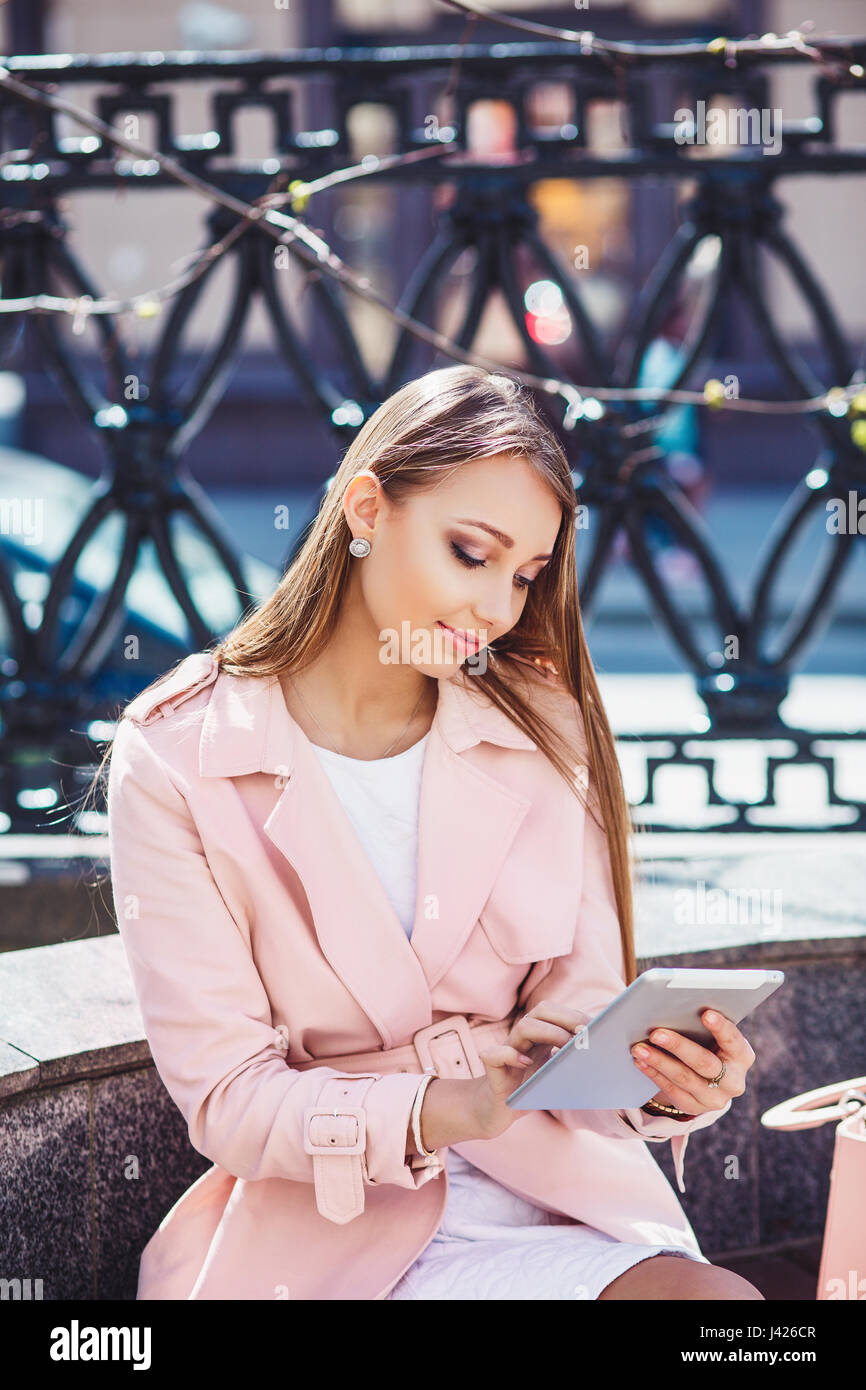 Businesswoman on break in park. Young professional business woman using ...