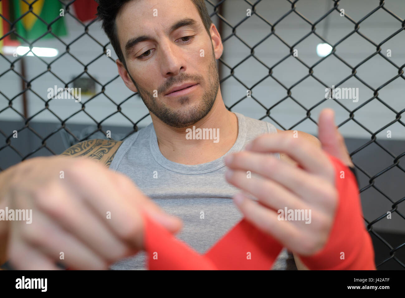 Sportsman wrapping tape around hand Stock Photo - Alamy