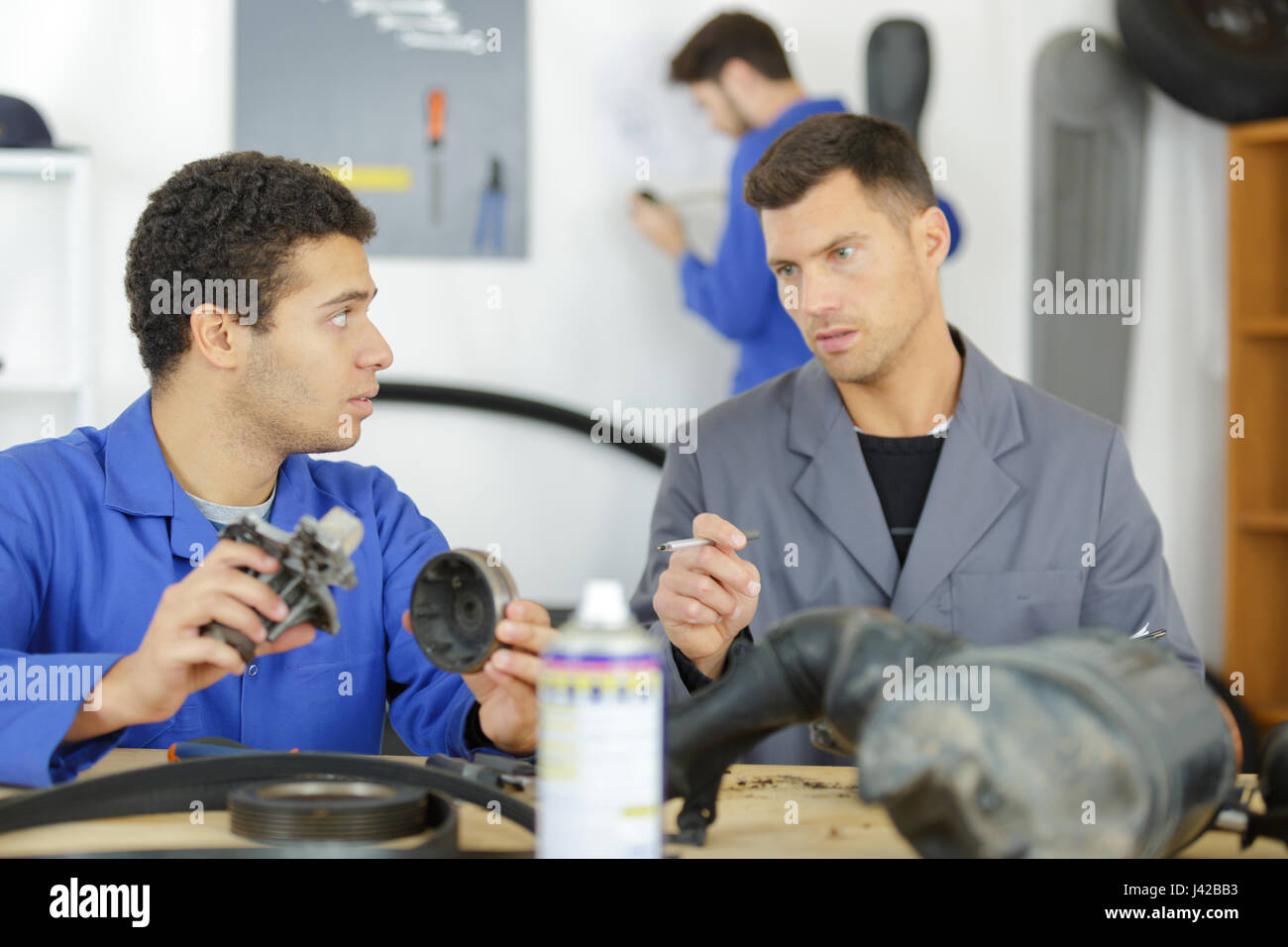 Teacher advising engineering student Stock Photo - Alamy