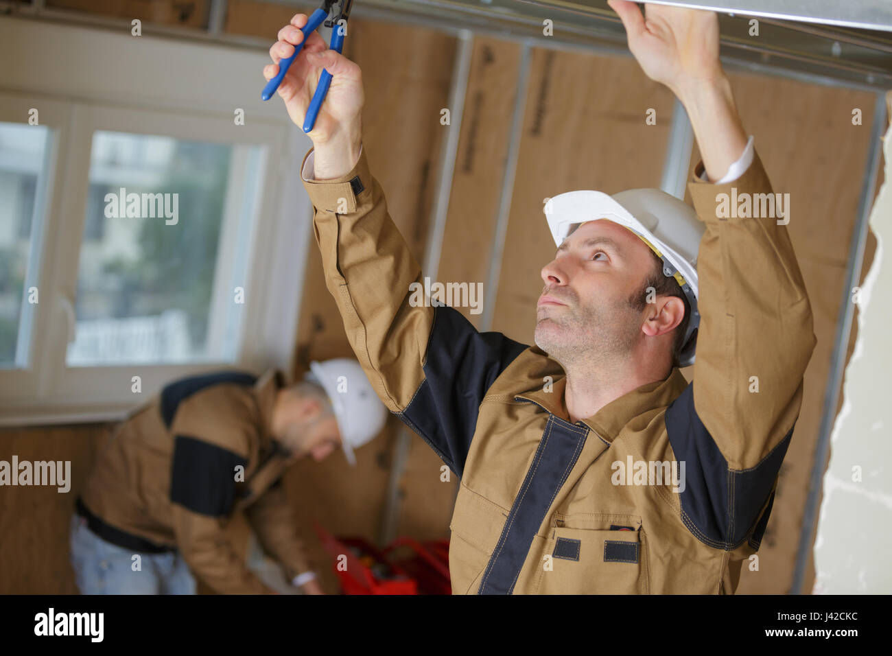 Tradesmen at work Stock Photo - Alamy