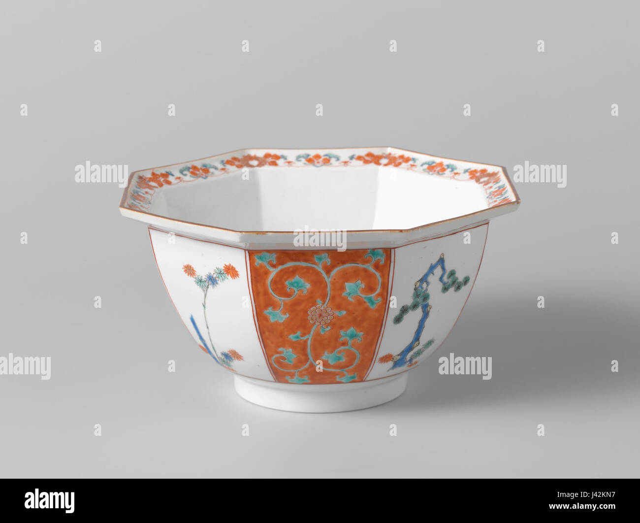 This octagonal piece with an outwardly flared rim, painted with a ...