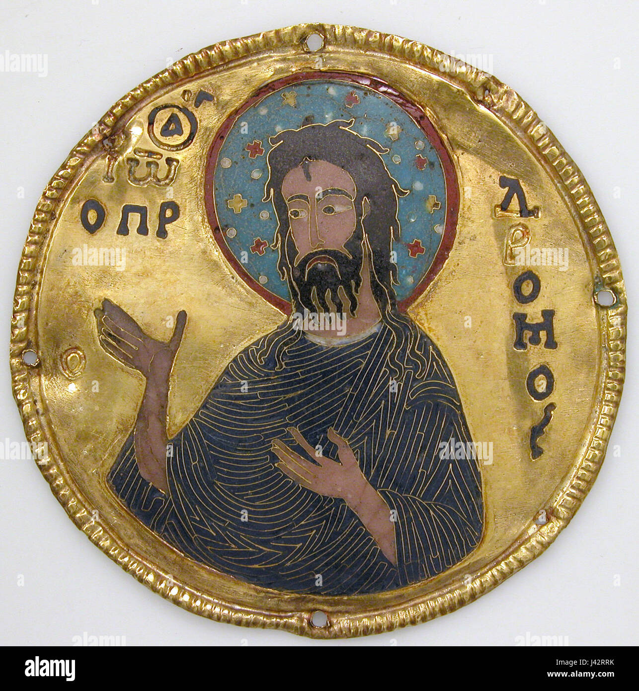 A medallion featuring Saint John the Baptist, framed within an icon ...