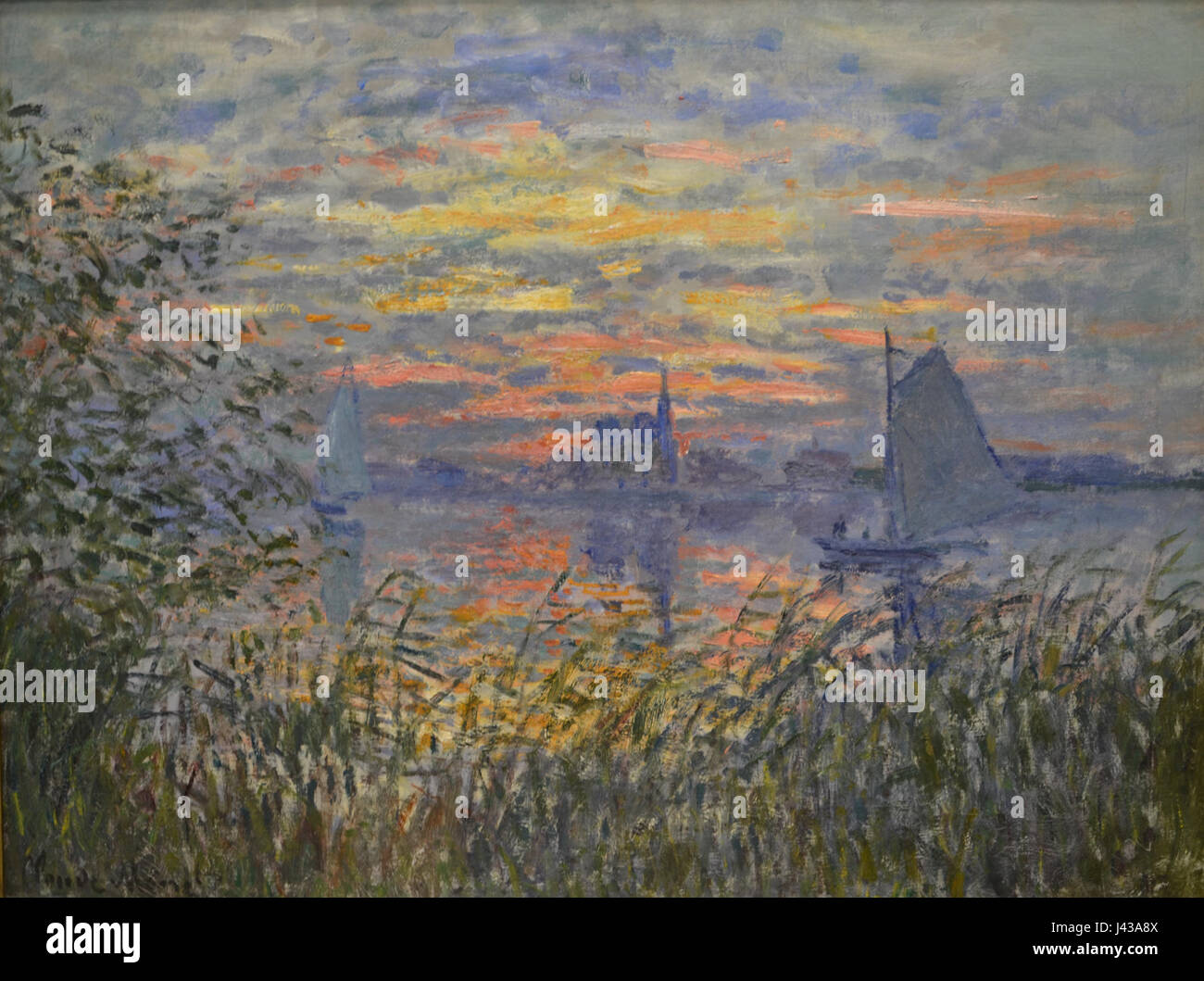 This painting, *Marine View with a Sunset*, by Claude Monet, captures ...