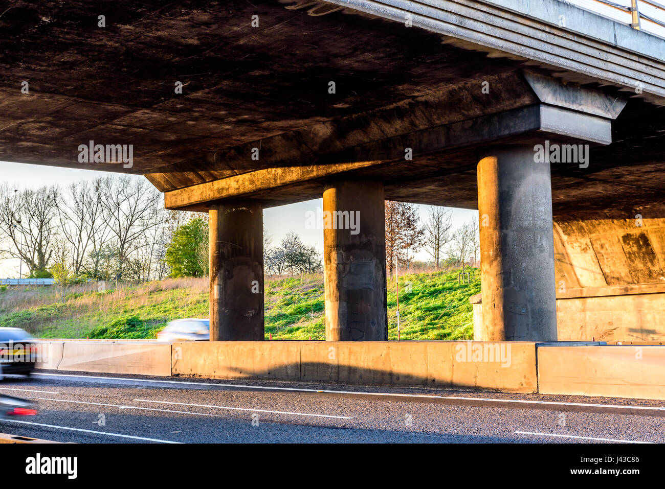 Empty UK Motorway under junction bridge evening Stock Photo - Alamy