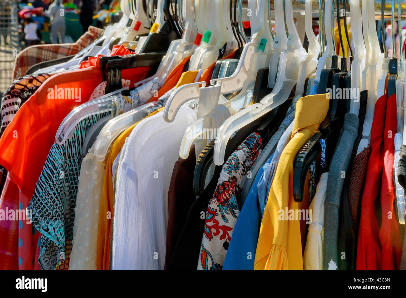fashion clothing on hangers at the show Stock Photo - Alamy