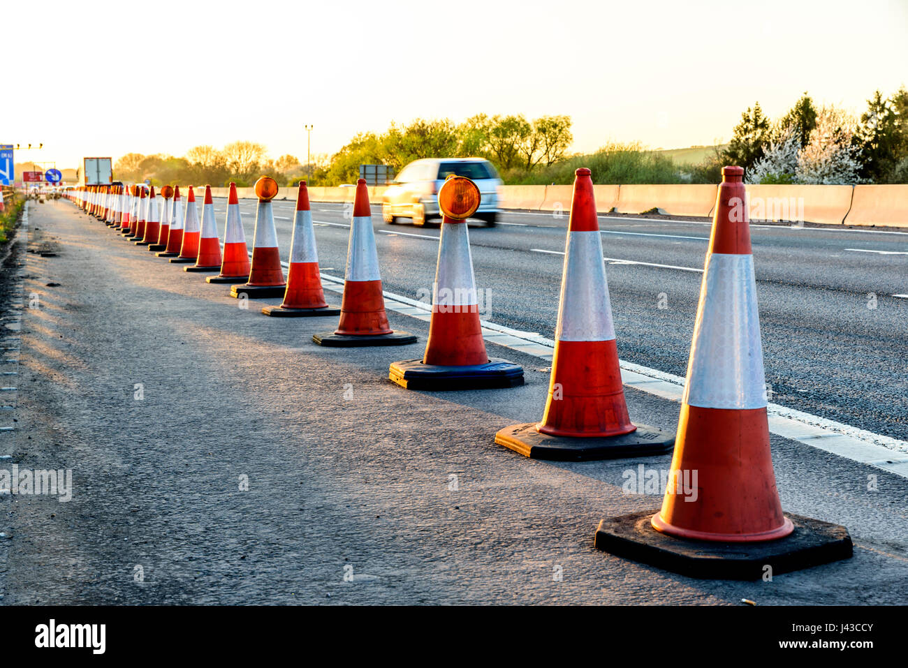 Evening view UK Motorway Services Roadworks Cones Stock Photo - Alamy