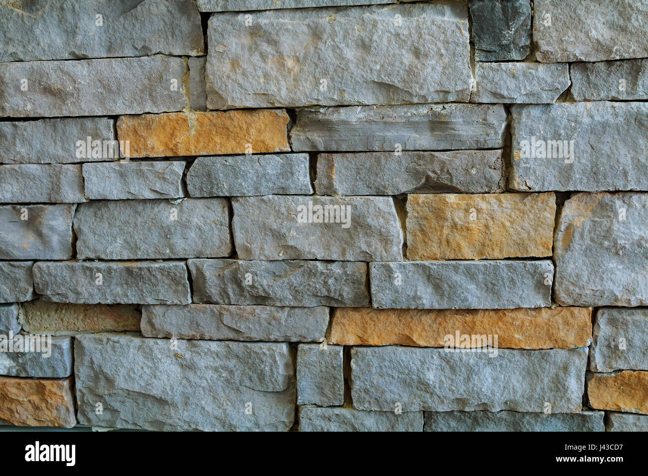 old long narrow worn down bricks make a wall., Flap orange rocks ...