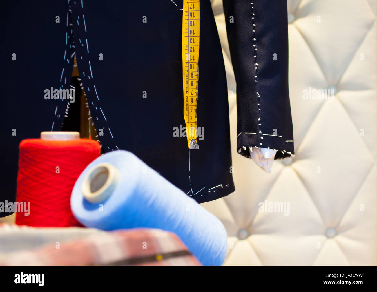 Tailor's shop with tools of the trade and cloth Stock Photo - Alamy