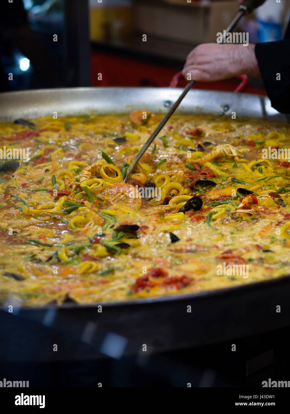Man preparing paella in spain hi-res stock photography and images - Alamy
