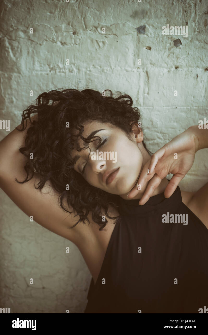Beautiful young woman hand touching neck Stock Photo - Alamy