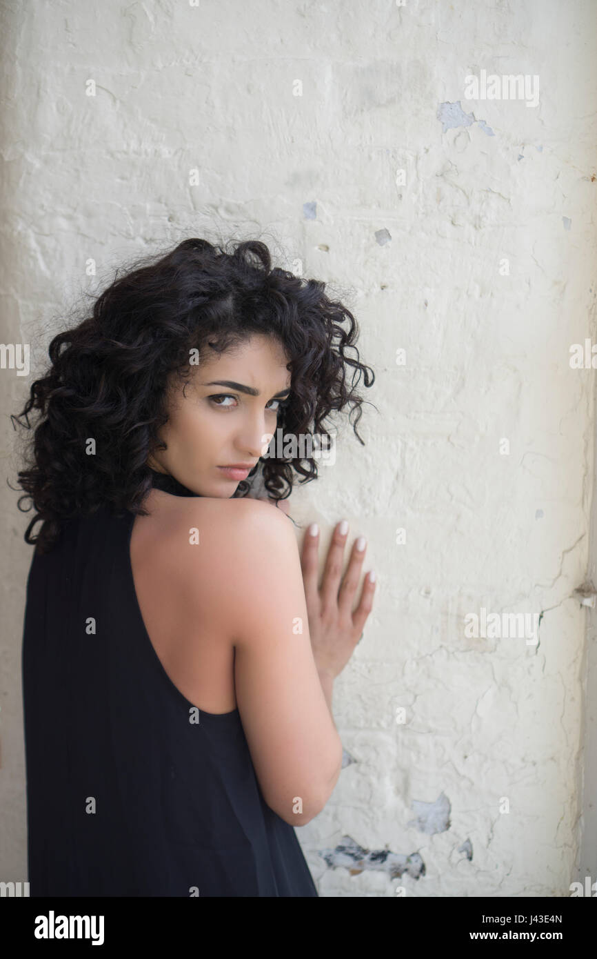 Woman Looking Down Over Shoulder