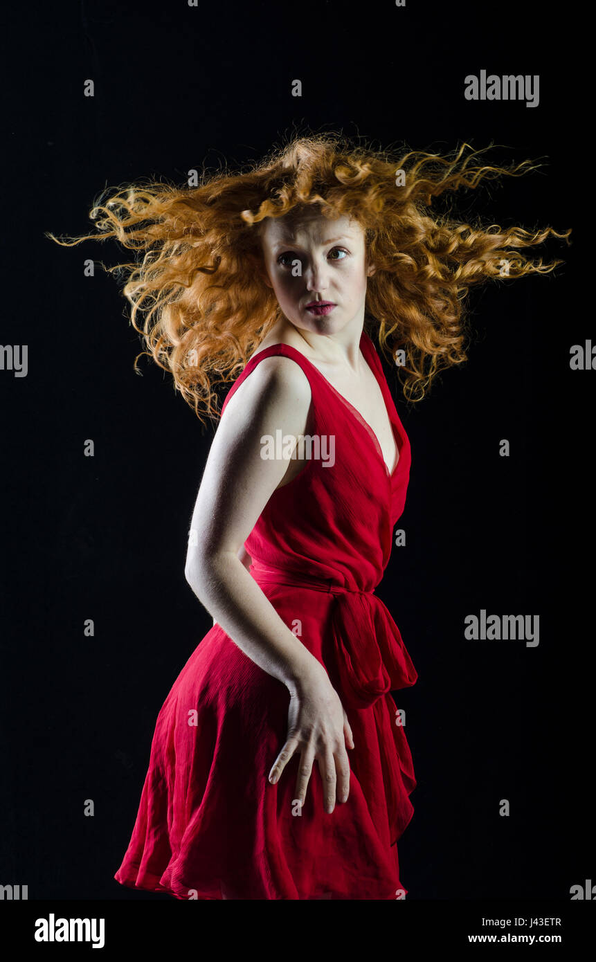 Scared redhead woman running away looking back in fear Stock Photo - Alamy Scared redhead woman running away looking back in fear Stock Photo - Alamy