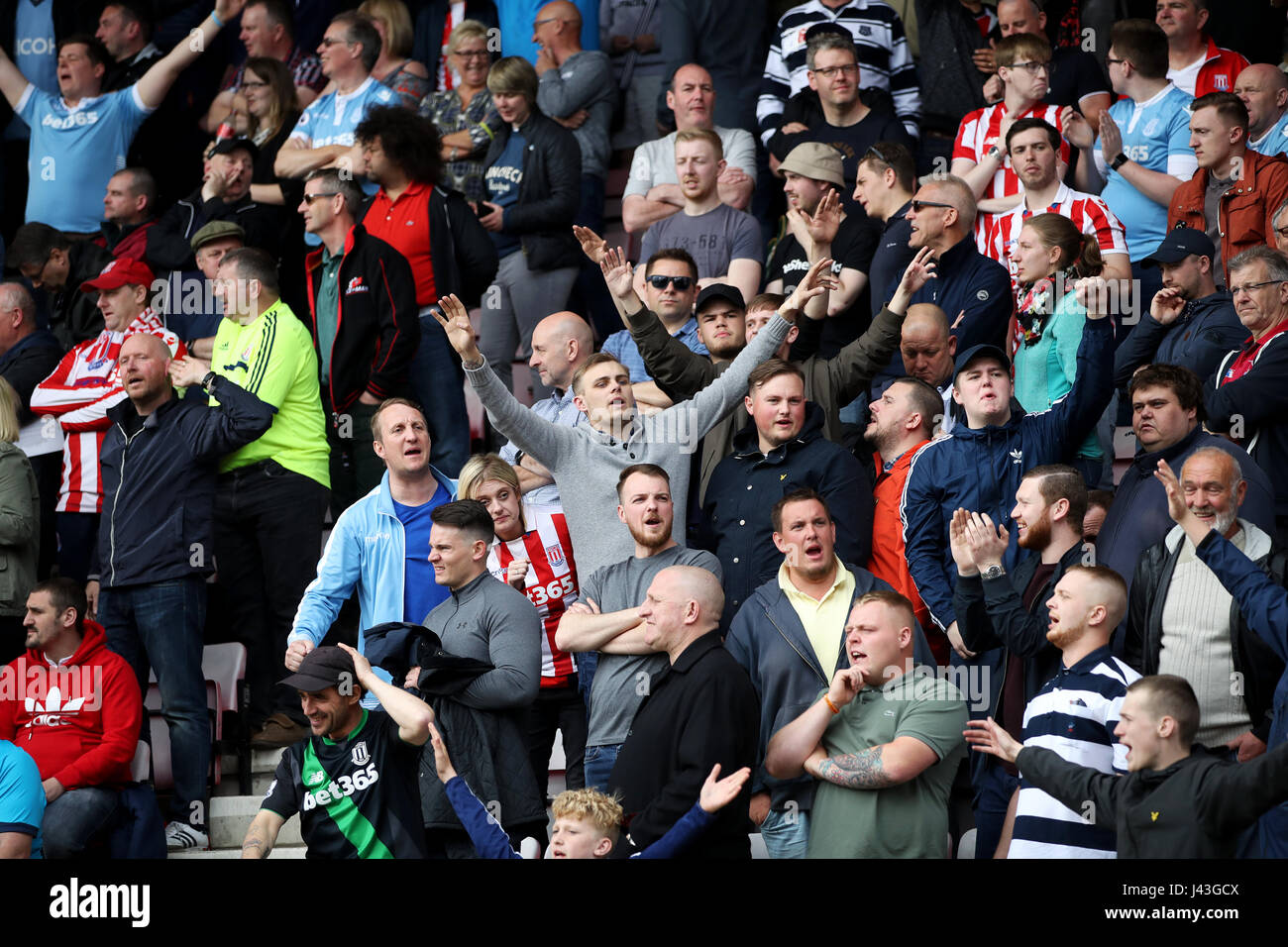 Stoke City fans in the stands Stock Photo - Alamy