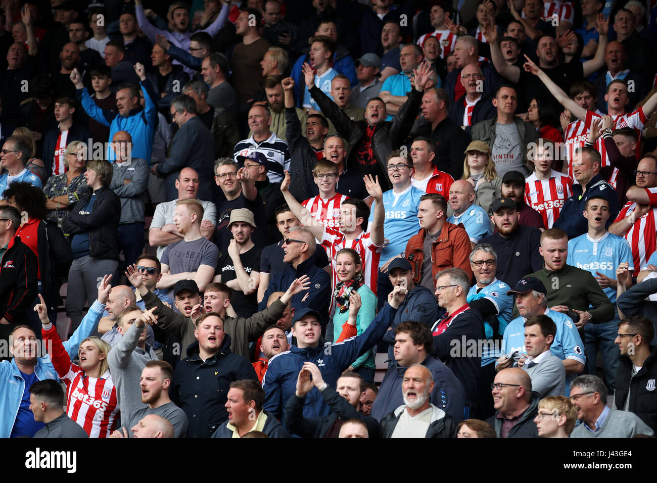 Stoke City fans in the stands Stock Photo - Alamy