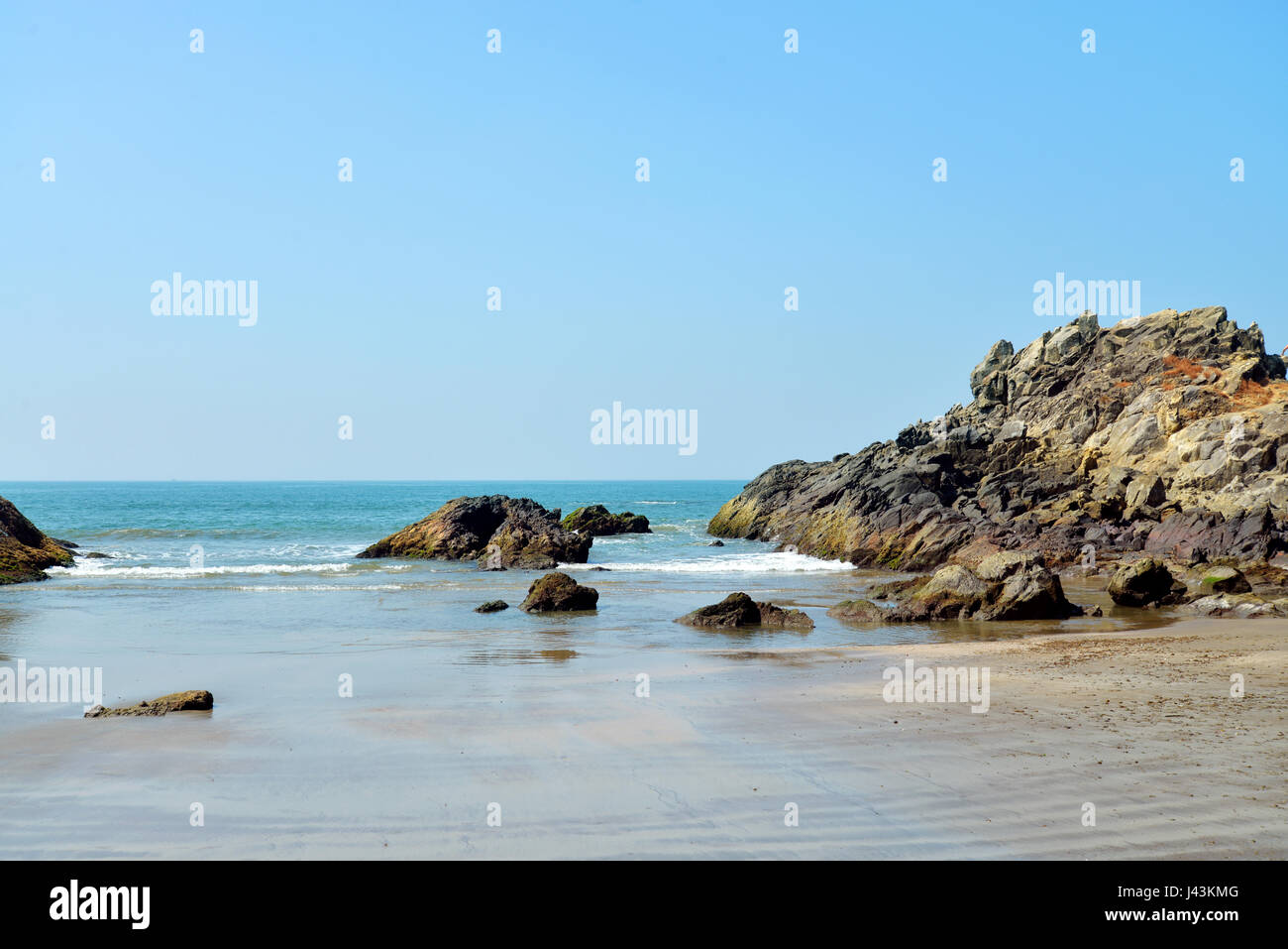 Rocks, sea and blue sky - Vagator beach, India, north Goa Stock Photo ...