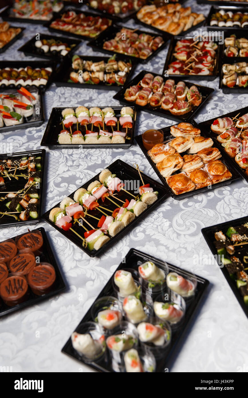 Festive table with assorted canapes Stock Photo - Alamy