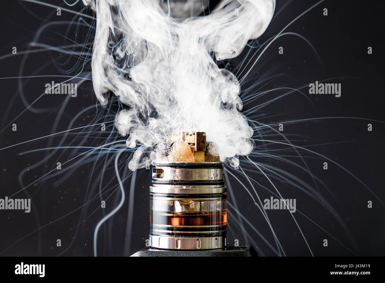 Vaporizer smoke explosion on isolated black background in studio Stock ...